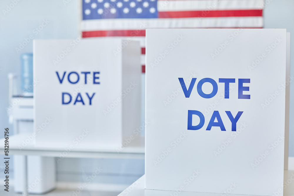 Background image of voting booths with words Vote day against American ...
