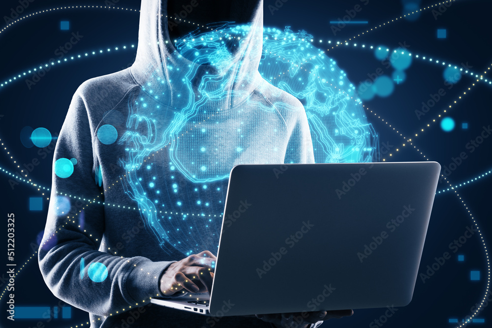 Hacker hand using laptop with bright globe hologram. A holographic ...