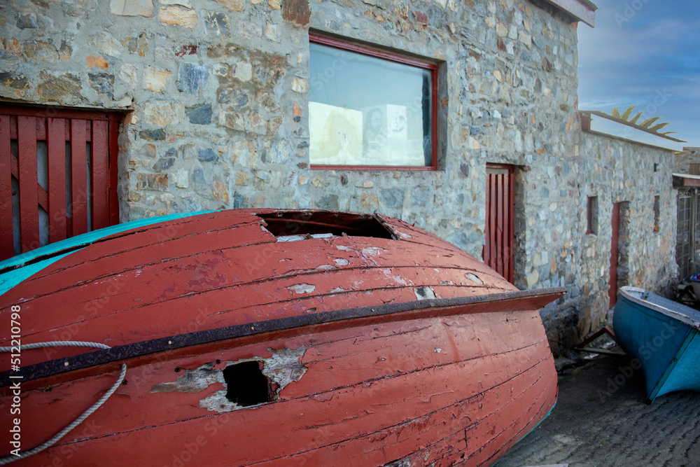 Boat in the old fishing pier of the South African city of Hermanus ...