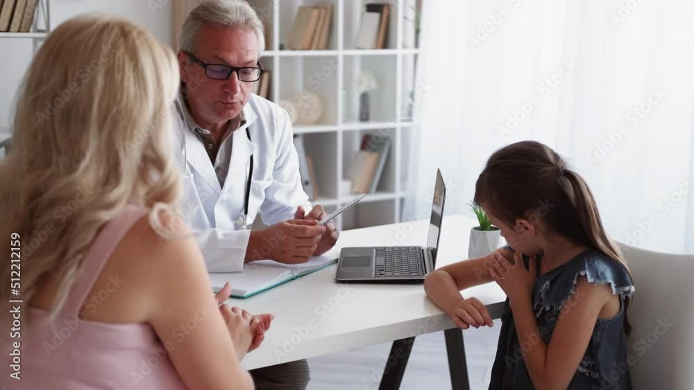 Pediatrician consultation. Kid checkup. Child medical care. Mother with ...