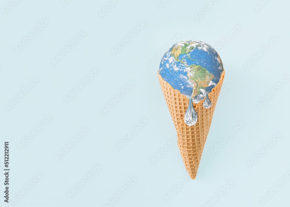 Planet Earth is melting in ice cream cone on isolated pastel blue ...