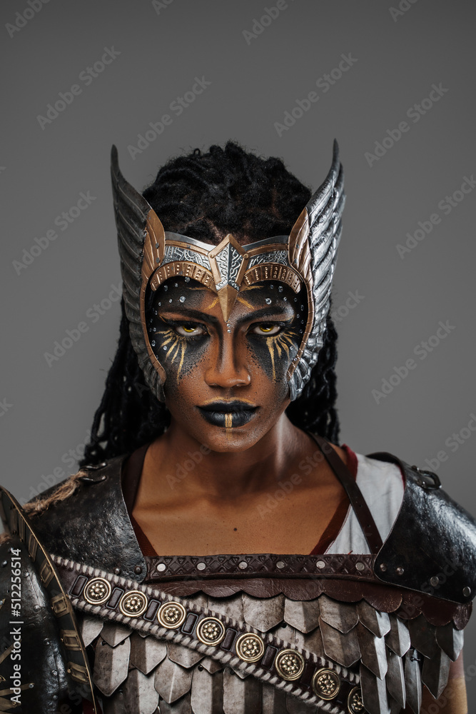 Studio shot of ancient black woman amazon staring at camera against ...