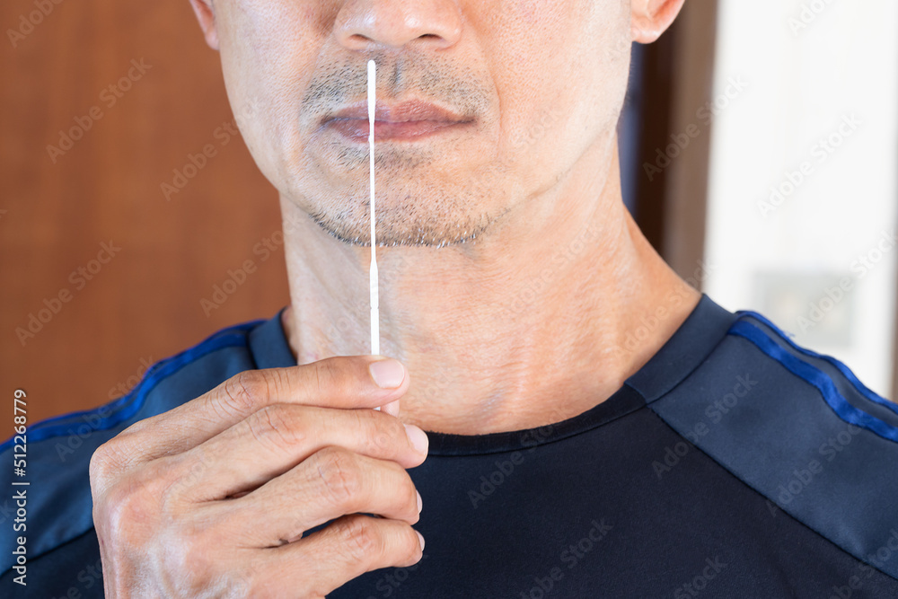 Man preparing for self test covid-19 at home with rapid antigen test ...