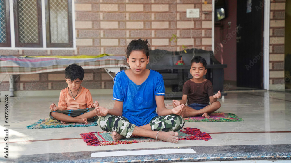 Asian kids doing yoga pose at home. Group of children doing gymnastic ...