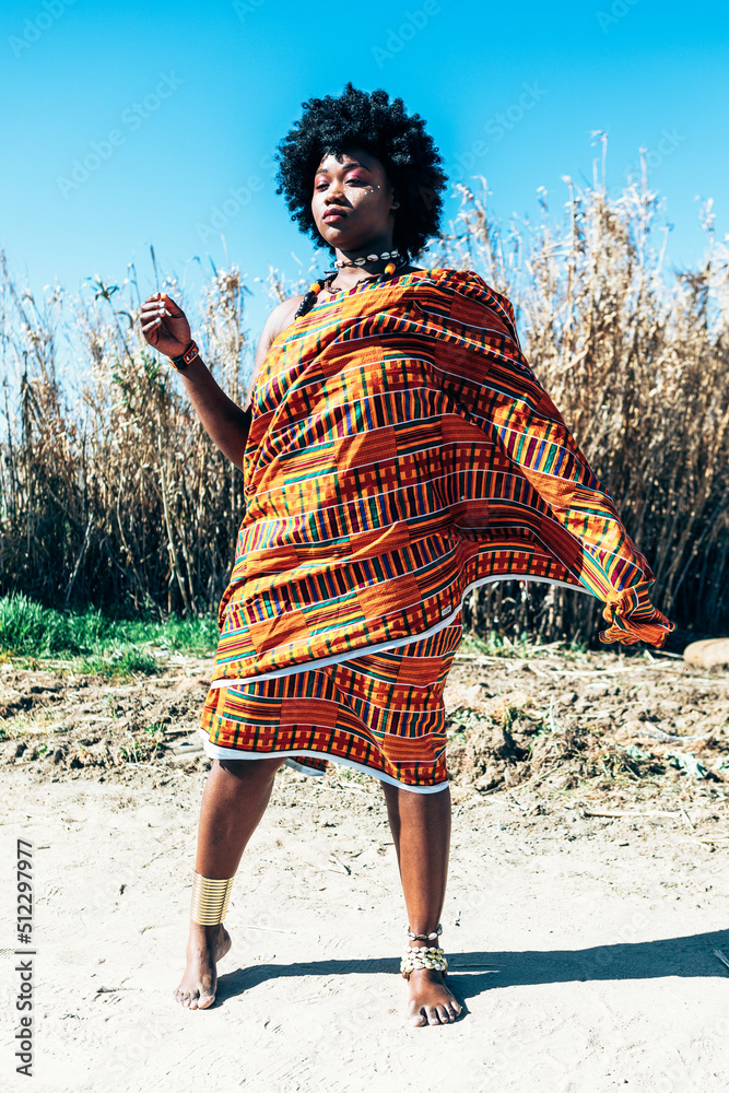 Black woman in traditional African attire Stock Photo | Adobe Stock