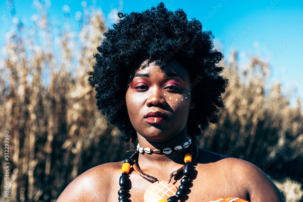Black woman in traditional African attire Stock Photo | Adobe Stock