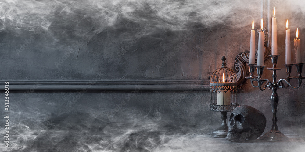 Mystical Halloween still-life background. Skull, candlestick with ...
