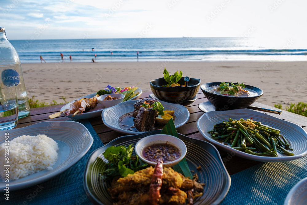 Thai food on a table on the beach in Thailand. table with Thai food ...