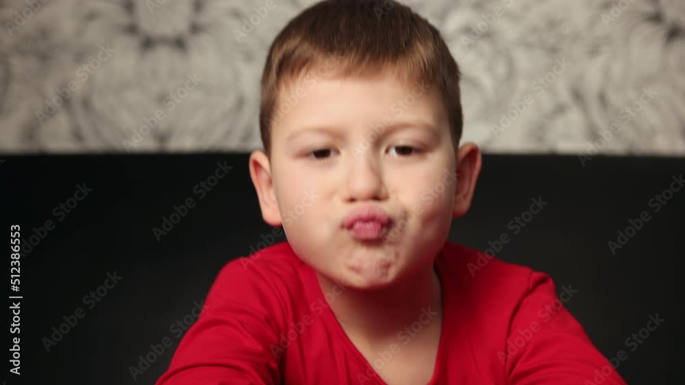 Adorable young happy boy looking straight ahead. Close-up portrait of ...