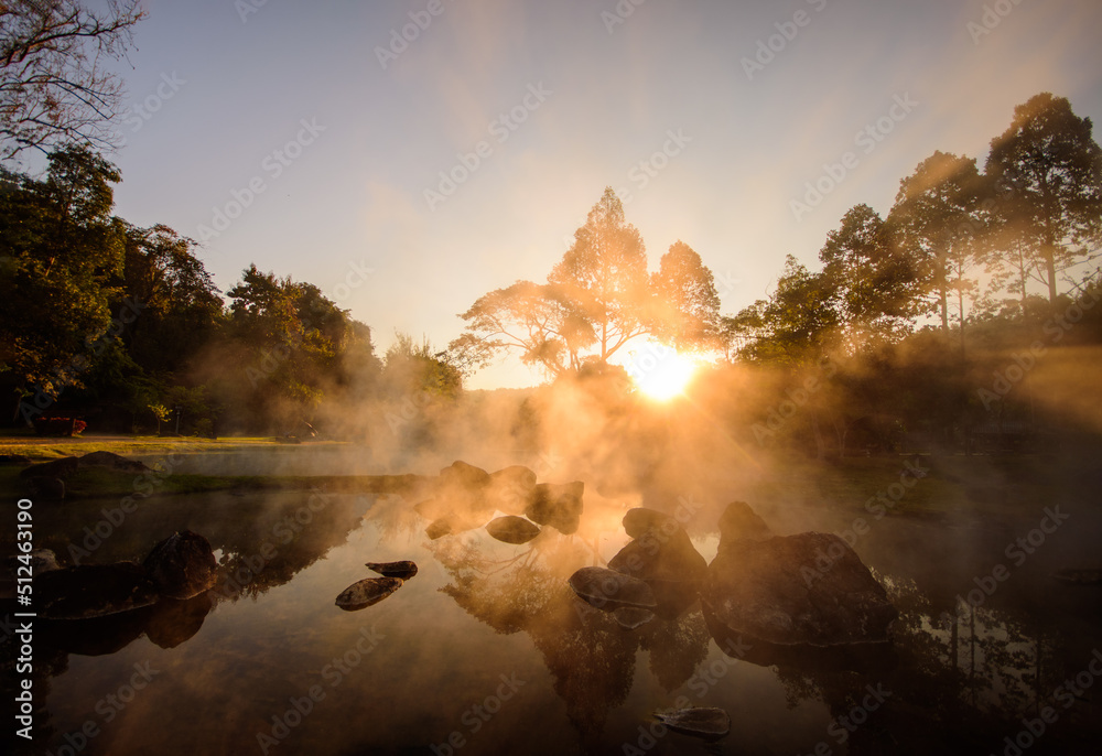 Hot springs and fog in with sunlight at morning Sunrise above hot ...