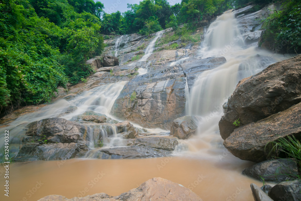 Beautiful Bamni waterfall having full streams of water flowing downhill ...