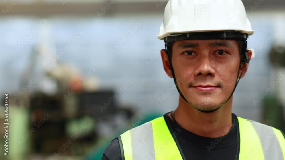Portrait Asian man worker look at camera. Metal machine in heavy ...