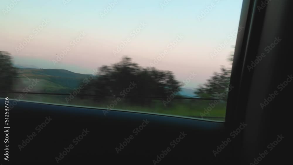 Driving car window view to nature mountains landscape on sunset in m ...