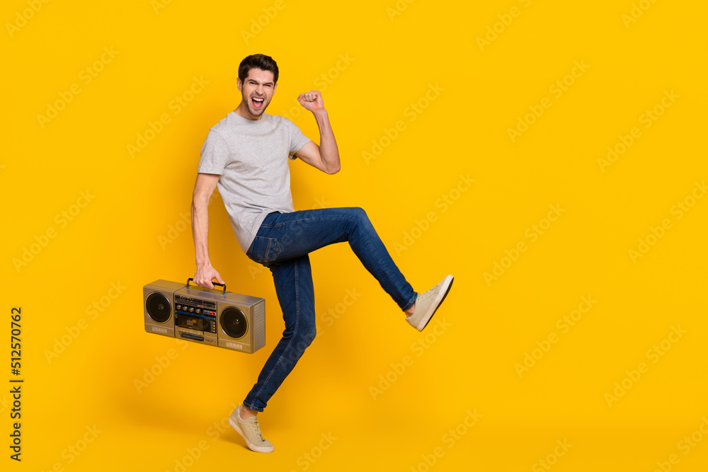 Full length body size view of attractive cheerful guy dancing listening ...