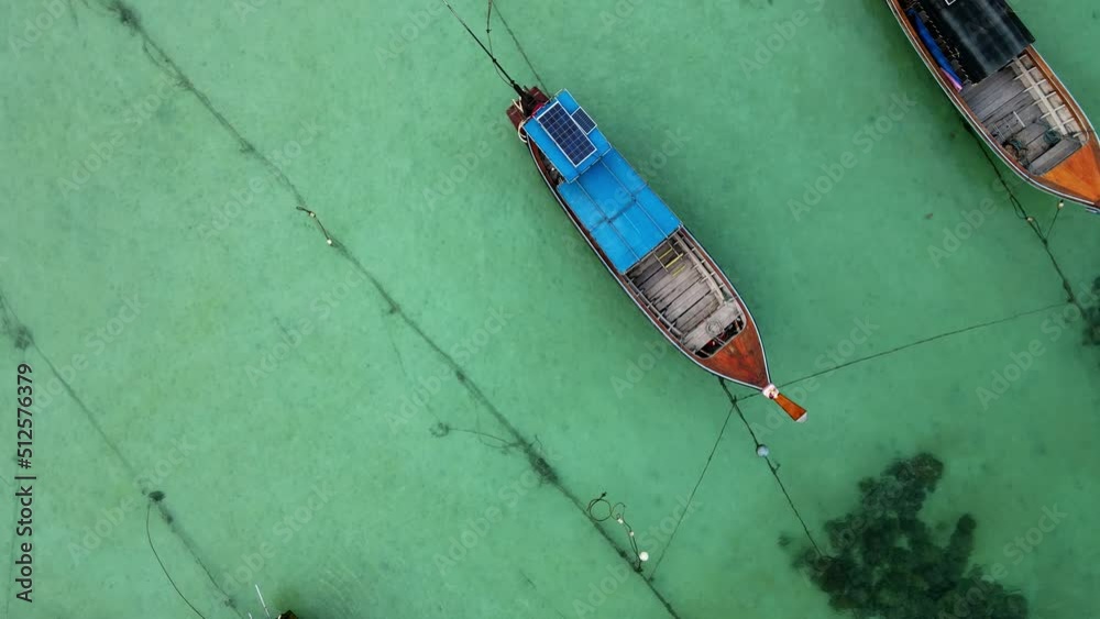 Slow Spinning Aerial Birds Eye View Of Moored Traditional Longtail ...
