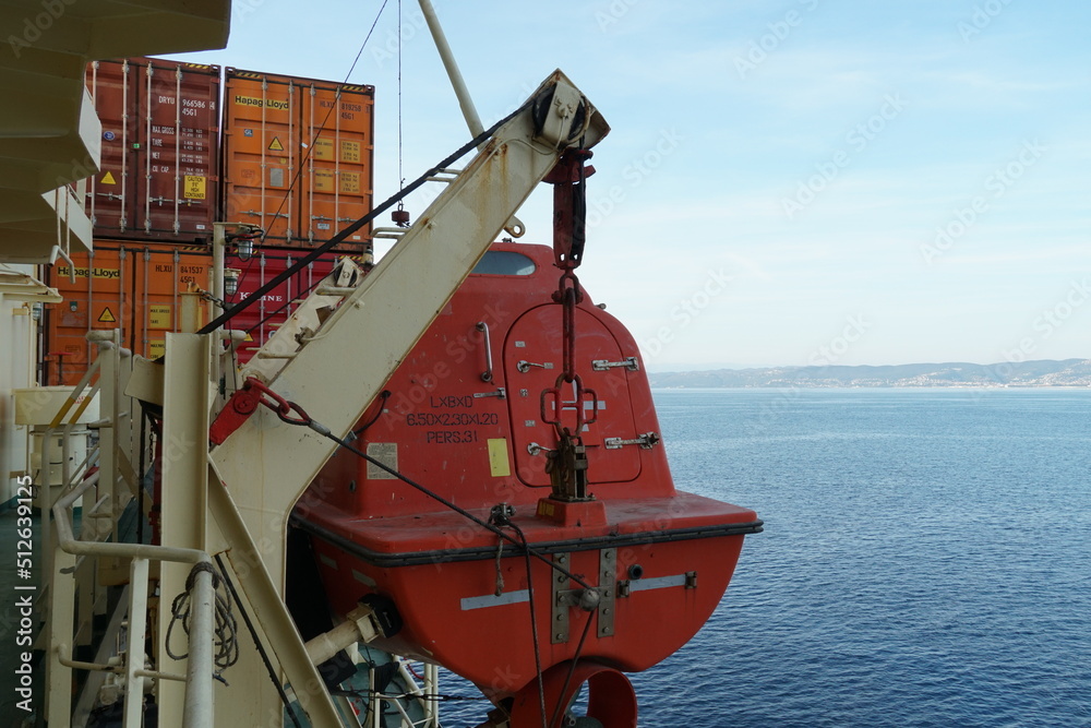 View on the orange colour lifeboat with reflective tape stickers ...