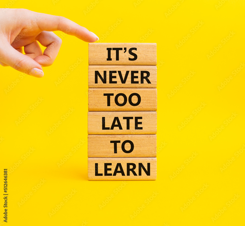 It's Never to Late to Learn symbol. Wooden blocks with words It's Never ...