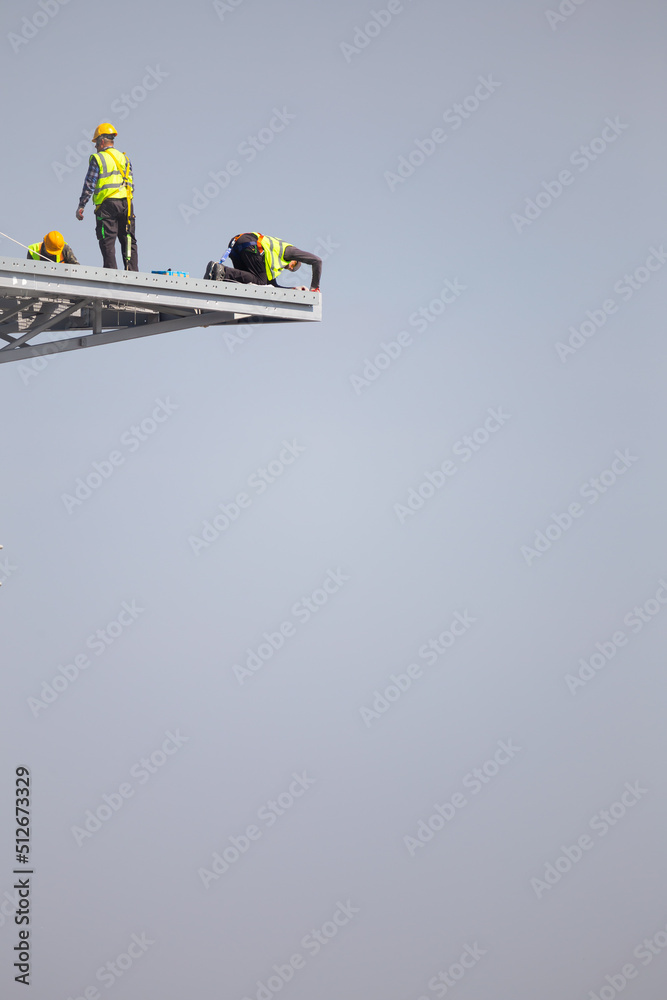 Workers working at height during the construction of a modern facility ...