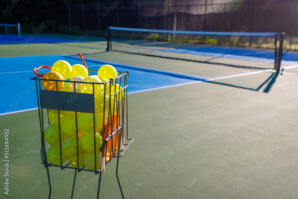 Basket of Pickleball balls on court Stock Photo | Adobe Stock