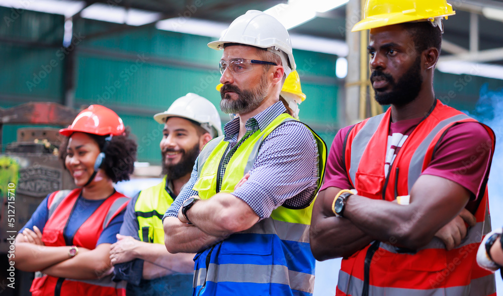 Arms crossed. Professional team working at workplace. Unity and ...