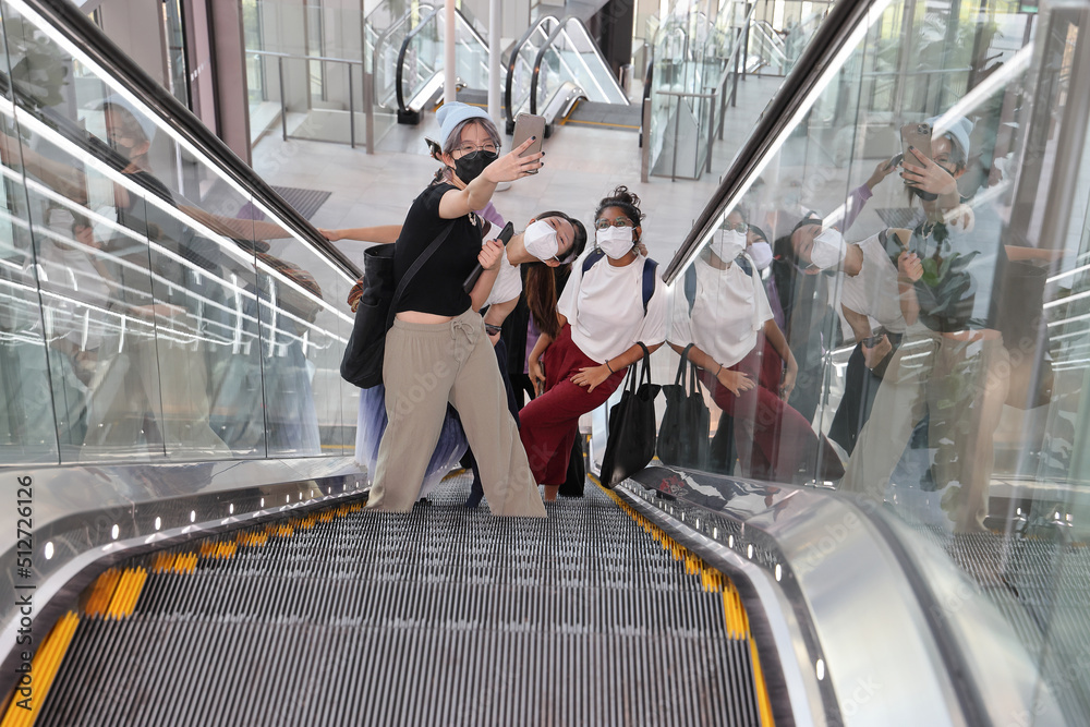 Four young attractive Asian group woman friends colleagues students ...