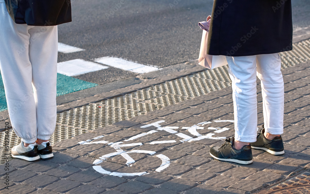 Women legs on road for bicycle. Bicycle way, sign marking on road ...