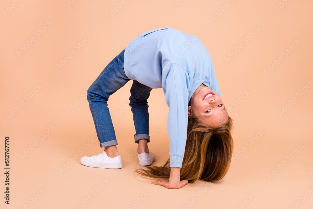 Full size photo of funny cute pupil practice acrobatics standing bridge ...