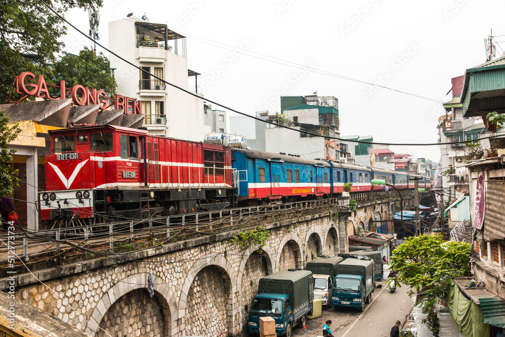 Red Train locomotive coming to Long Bien railway station, Hanoi ...