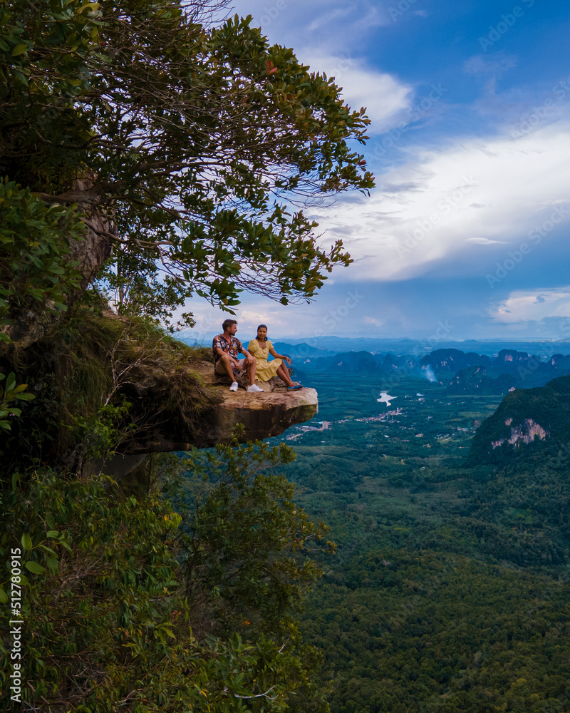 Dragon Crest mountain Krabi Thailand, a Young traveler sits on a rock ...