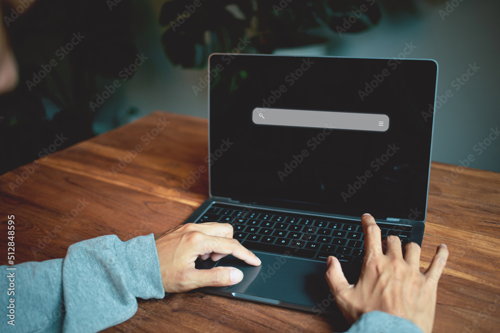 People are using keyboards to search and scroll through laptop ...