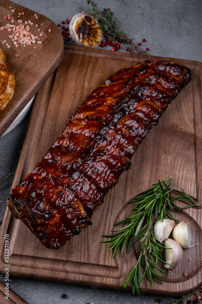 Dark and moody rack of meaty baby back ribs with spicy dry rib rub ...