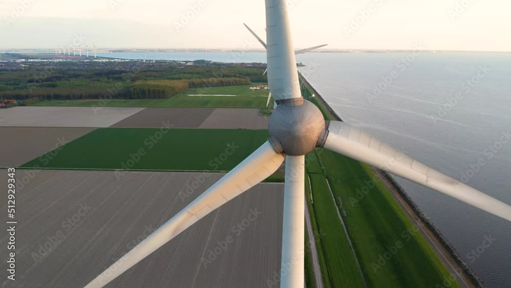 Wind turbines aerial close view. Working offshore wind farm, sunset ...
