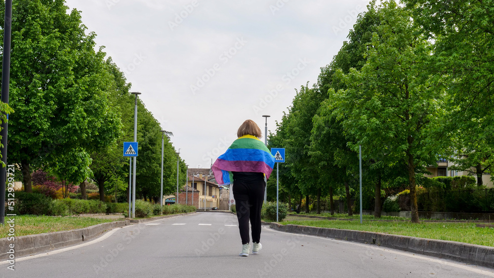 Bisexual, lesbian, female, transgender walk with rainbow LGBTQIA flag ...