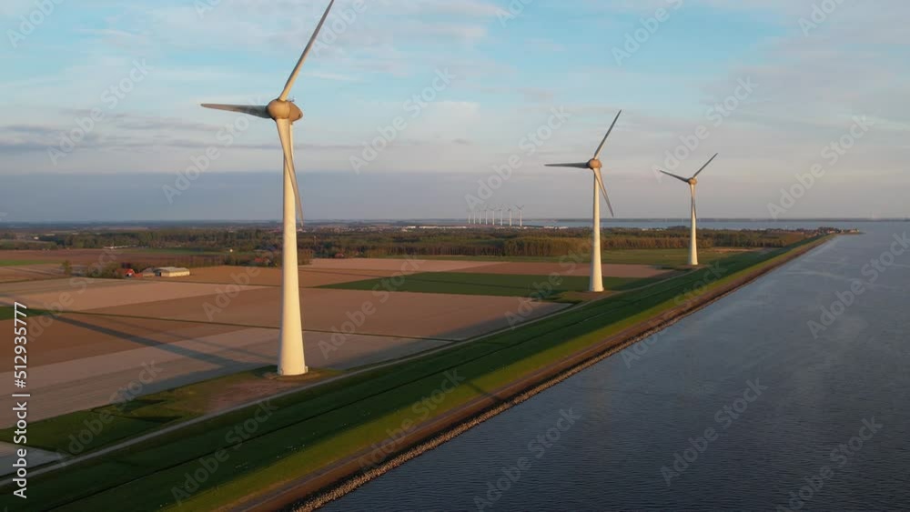 Wind turbines aerial view. Working offshore wind farm, sunset cinematic ...