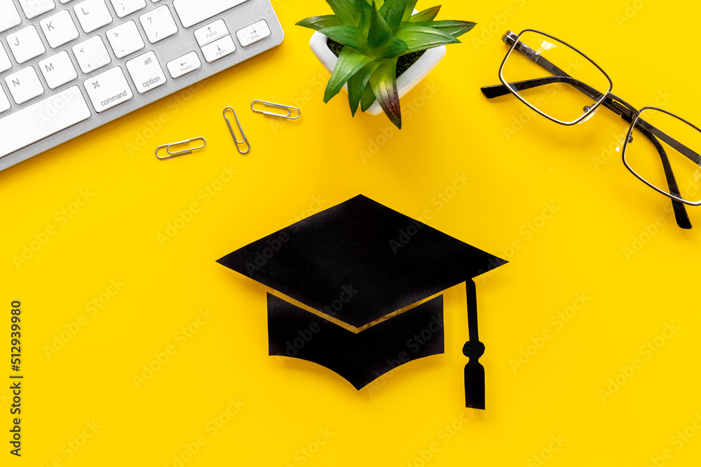 Black academic cap or graduation hat on students table, top view Stock ...