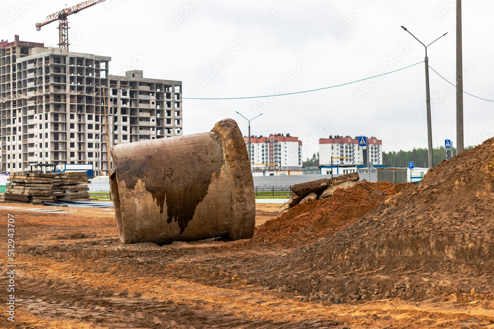 Soil excavation at the construction site. A pile of sand and earth ...