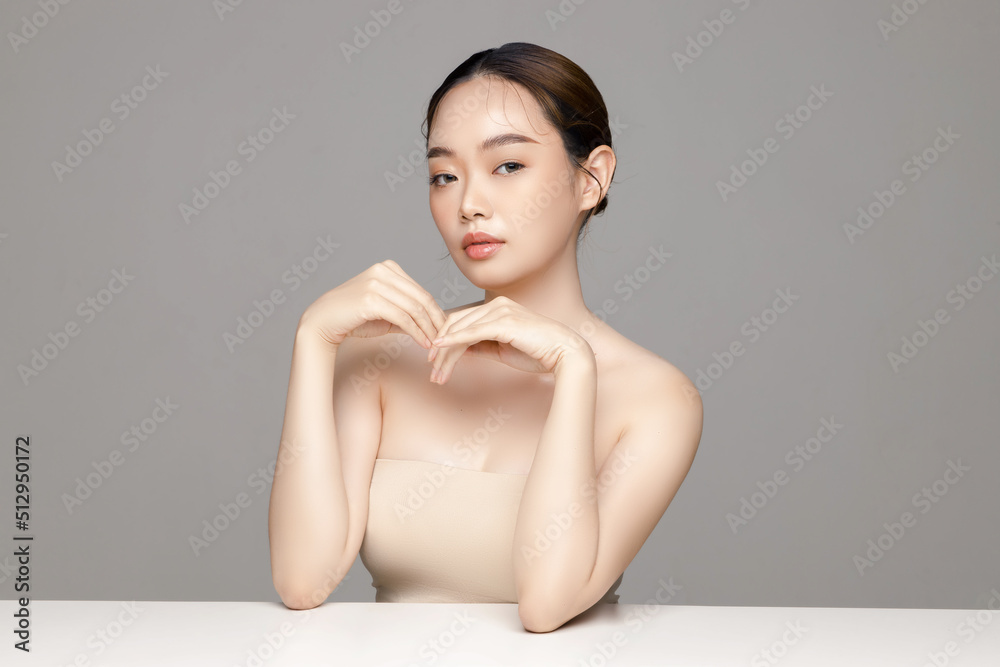 Beautiful Young Asian Woman Model With Perfect Clean Fresh Skin On Grey