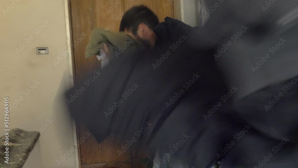 conflict, anger-woman kicks her partner out of the house by throwing ...