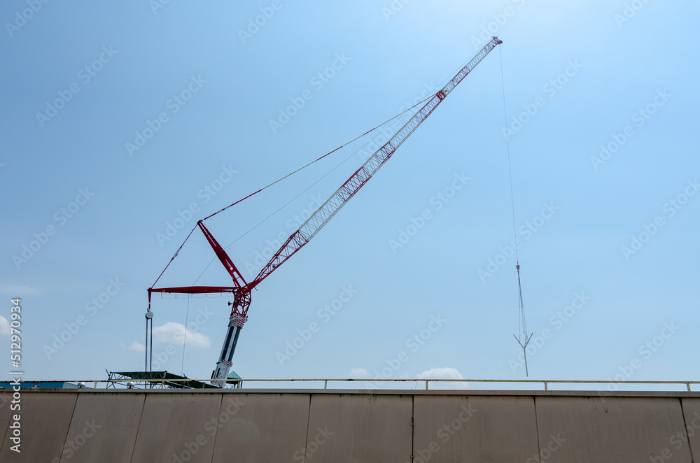tower crane, on a construction site, for moving materials with ...
