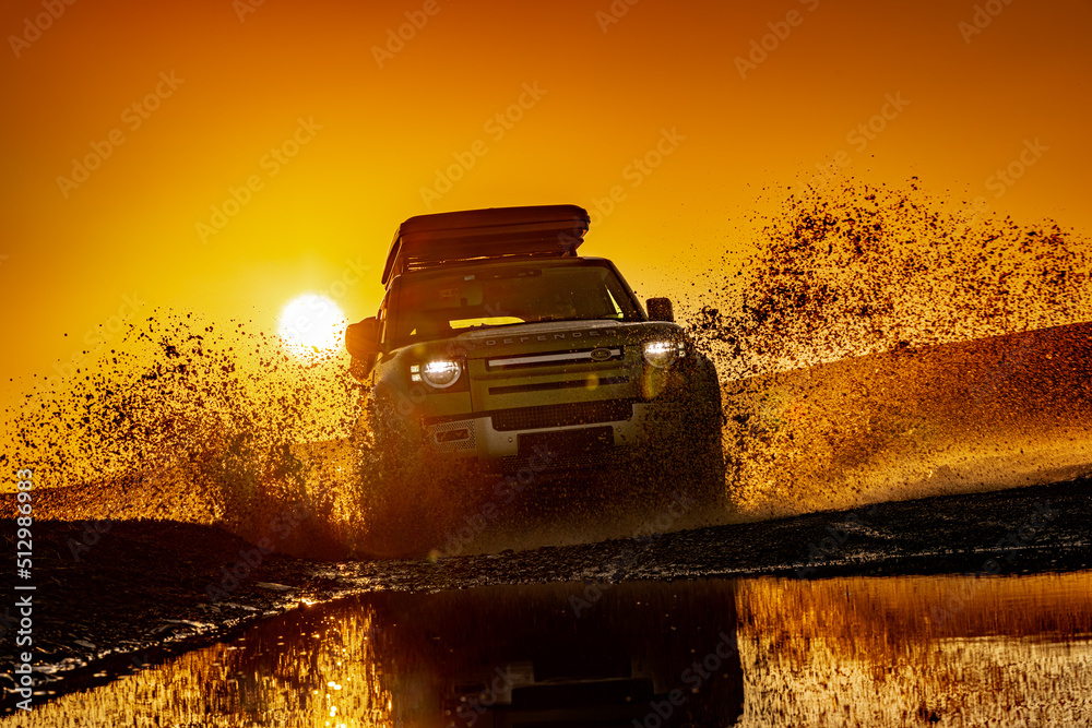 Rybachy, RUSSIA - May 30 2022: Off-roading New Land Rover Defender. The ...