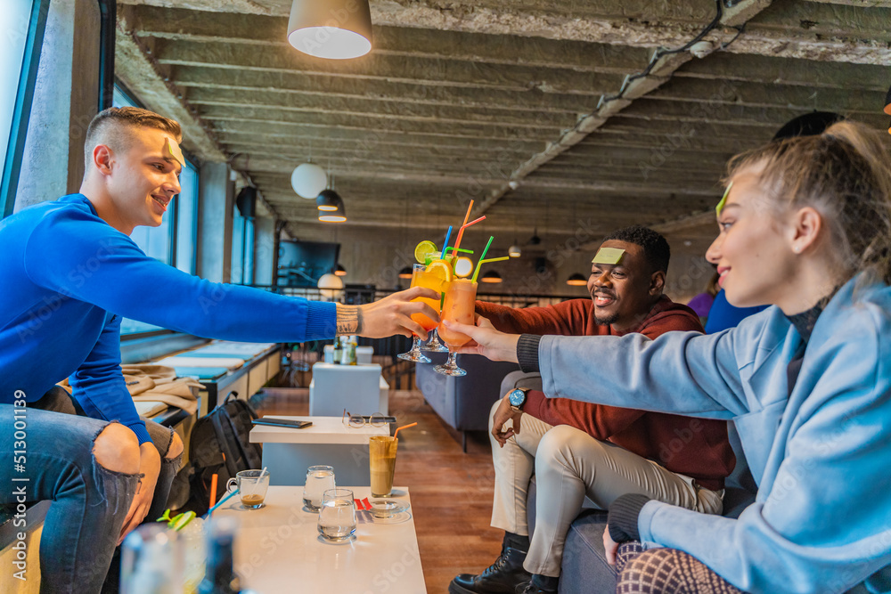 Doing a cheers with their cocktails Stock Photo | Adobe Stock