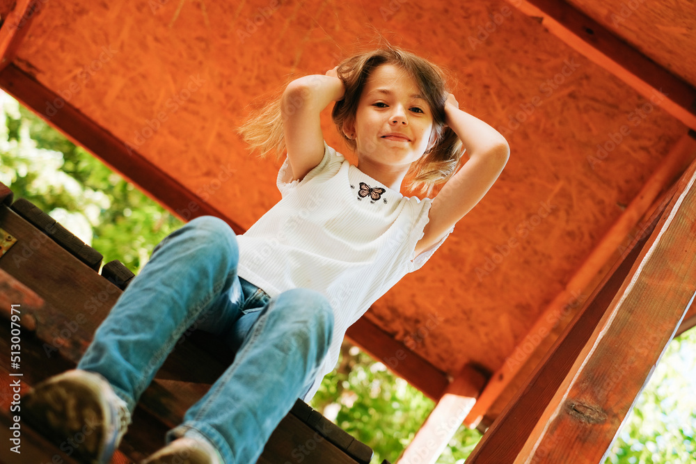 9-year-old girl laughs merrily, makes faces, makes faces at the ...