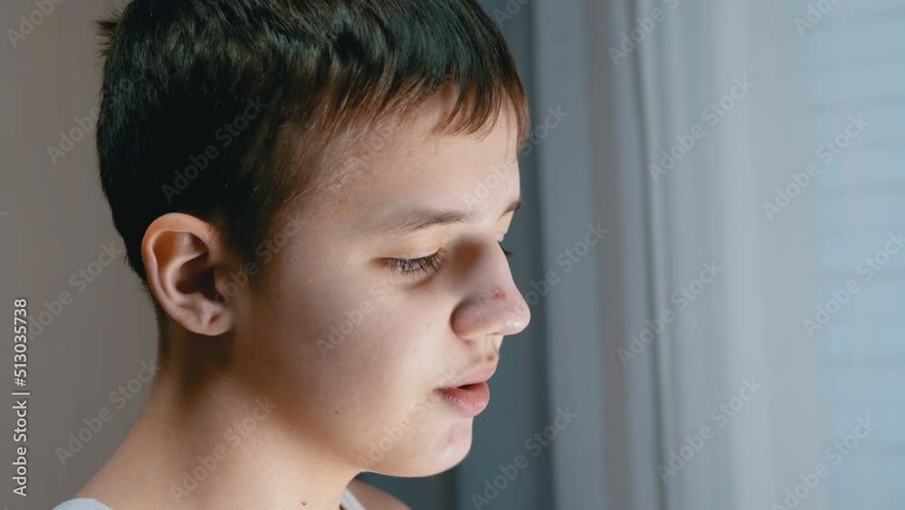Close-up of a Face Profile of Talking Smiling Teenager Looking Down ...