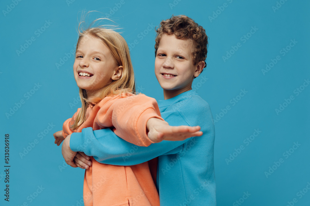 cute, beautiful, happy children, brother and sister stand in bright ...