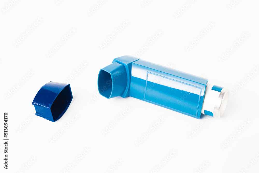 Blue asthma inhaler with blank label isolated on white background ...