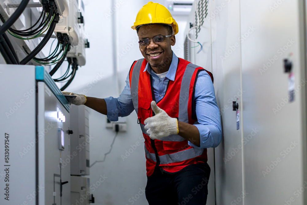 Electrical engineer working in control room. Electrical engineer man ...
