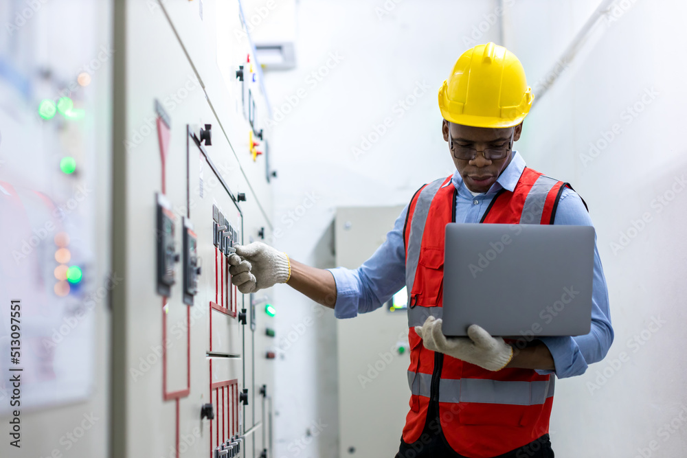 Electrical engineer working in control room. Electrical engineer man ...