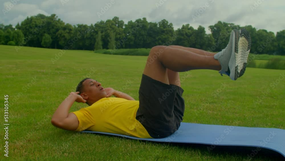 Motivated Athletic Handsome Black Man Lying On Fitness Mat Practicing