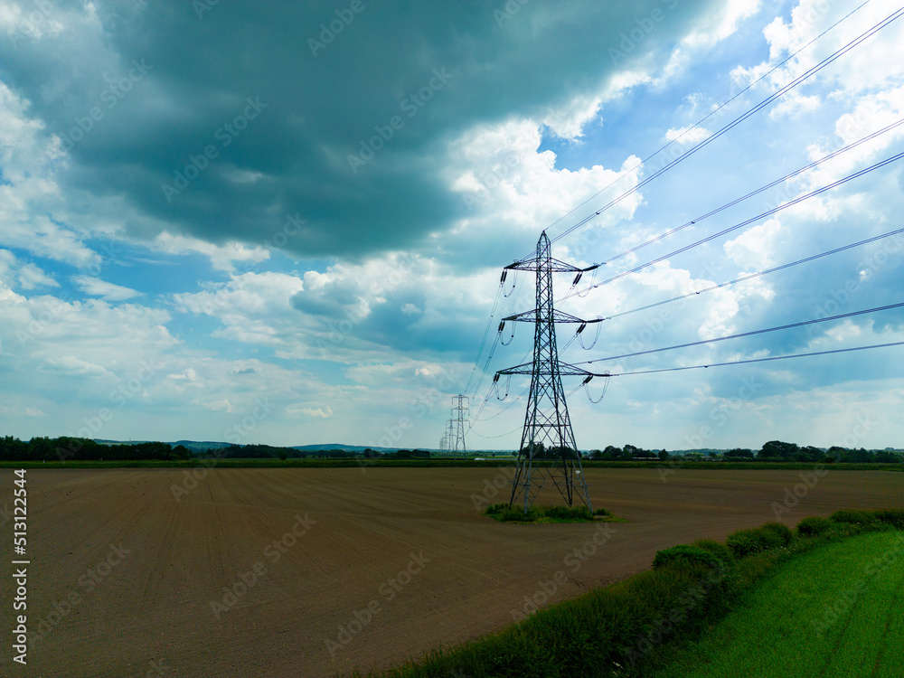 High aspect aerial image of an electricity pylon carrying high voltage ...