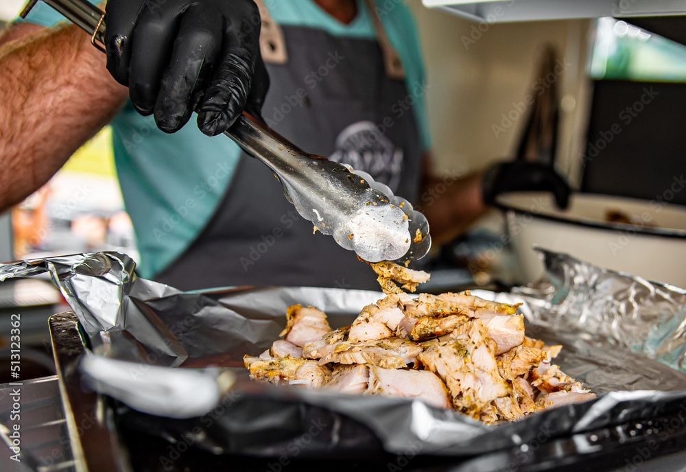process of preparing traditional greek fast food - gyros. chef hand ...